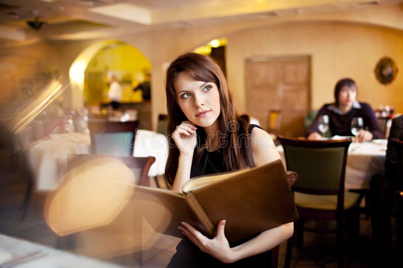 Girl with a Menu in a Restaurant Stock Image - Image of female, house ...