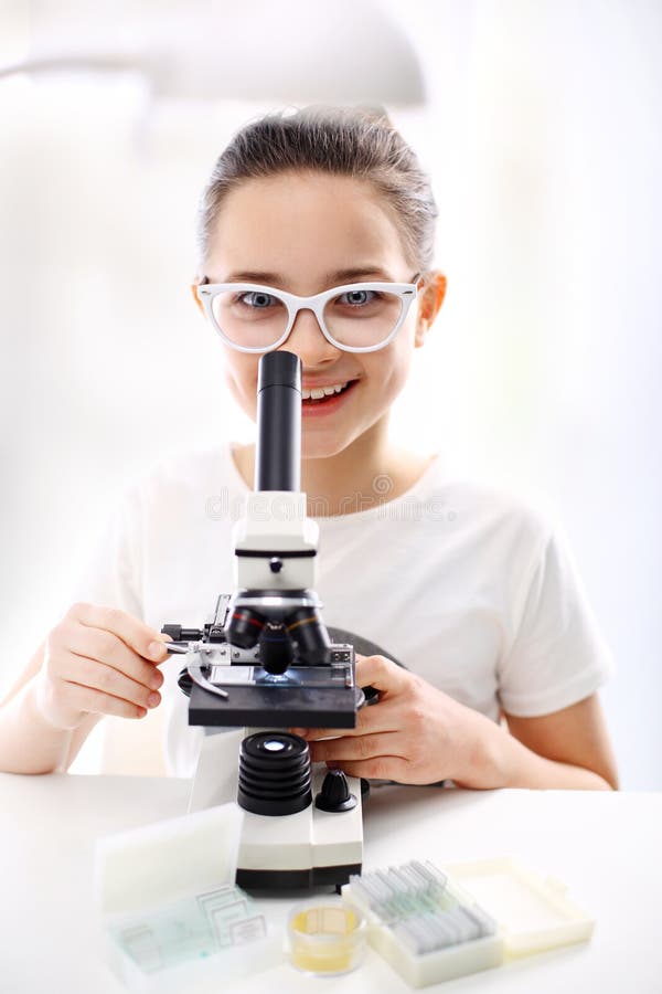 Girl with a microscope stock image. Image of child, cells - 50886487