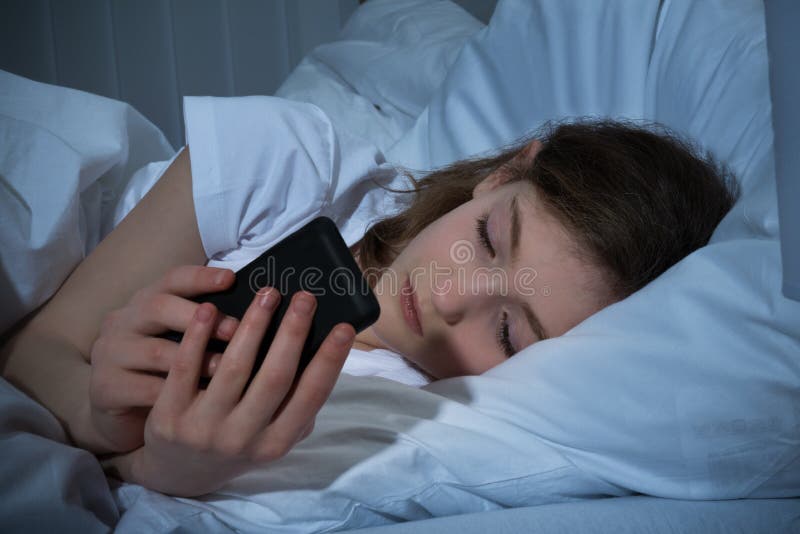 Girl with Mobile Phone on Bed Stock Image - Image of communication ...