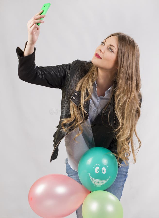 Girl Model in Studio with Balloons Makes Selfie Stock Image - Image of ...