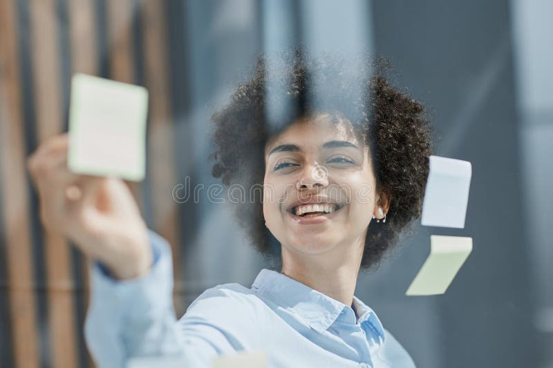 A Girl in a Modern Office Behind Glass Uses Sticky Notes and Makes ...