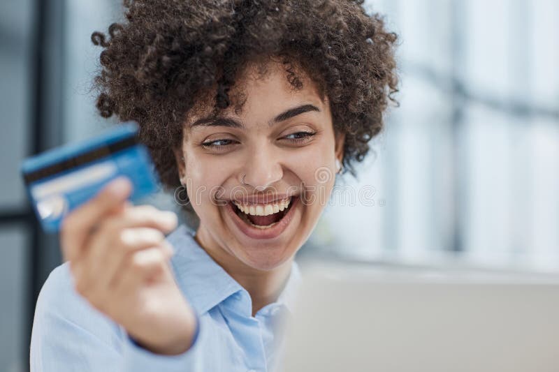 A Girl in a Modern Office Pays for Purchases on the Internet Using a ...