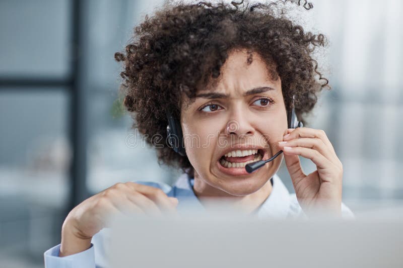 A Girl in a Modern Office Working in a Call Center Concentrates on ...