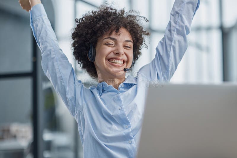 A Girl in a Modern Office Working in a Call Center Concentrates on ...