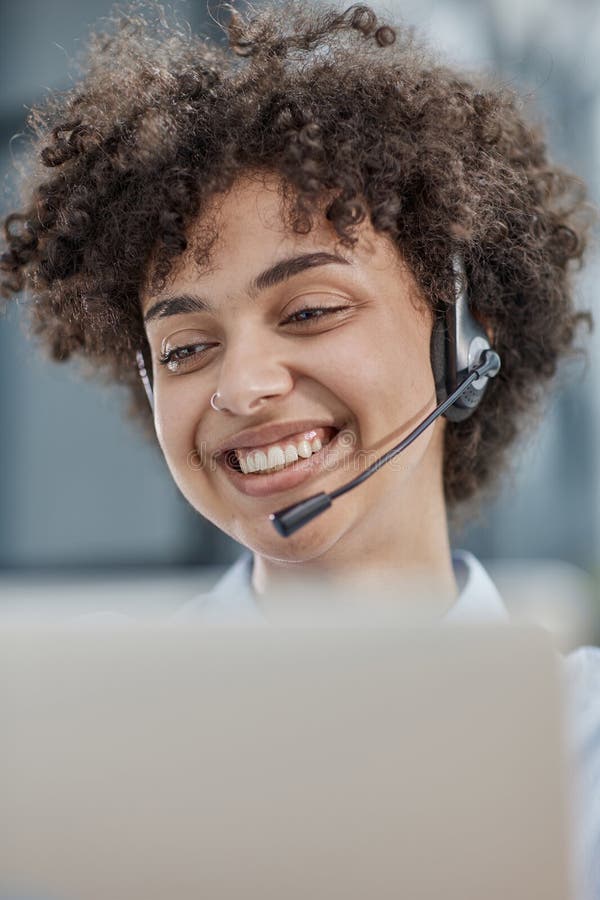 A Girl in a Modern Office Working in a Call Center Concentrates on ...