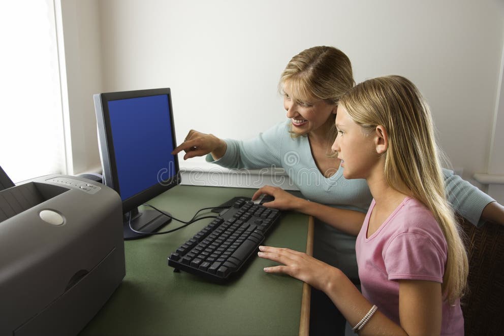 Girl and mom on computer. stock photo. Image of woman - 2038154