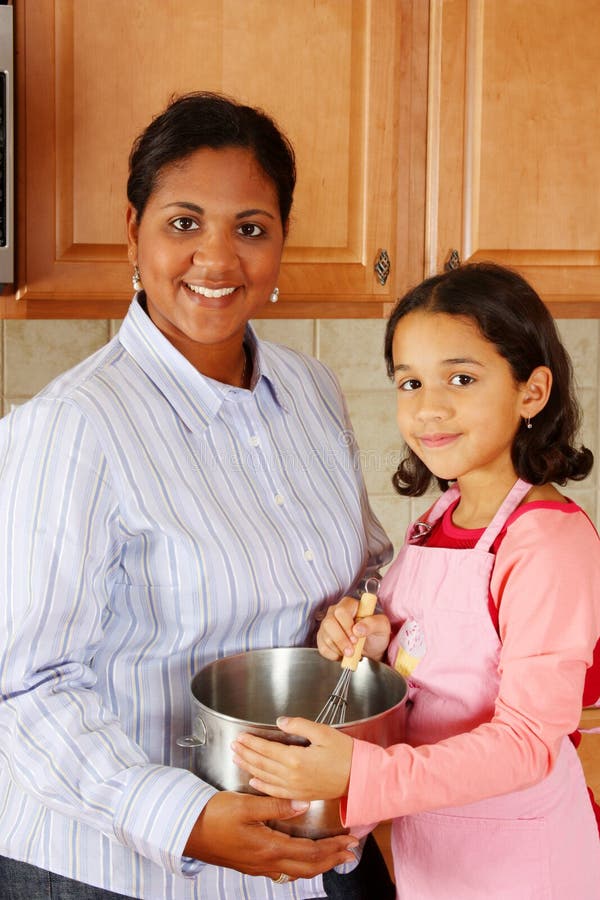 Girl and Mother Cooking stock image. Image of bake, hispanic - 7175687