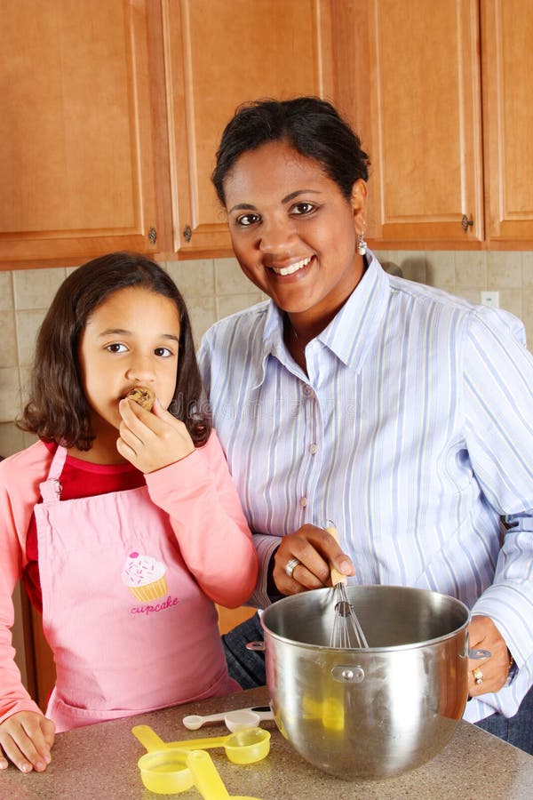 Girl and Mother Cooking stock photo. Image of cooking - 7175692