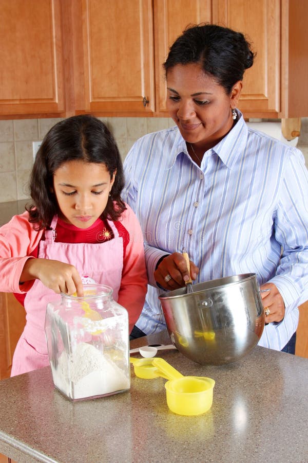 Girl and Mother Cooking stock image. Image of woman, cooking - 7175693