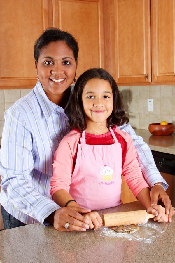 Girl and Mother Cooking stock photo. Image of brunette - 7175702