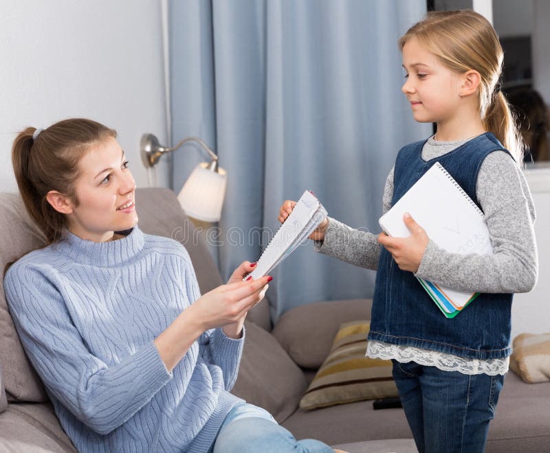 Girl and Mother Doing Home Task Stock Photo - Image of book, domestic ...