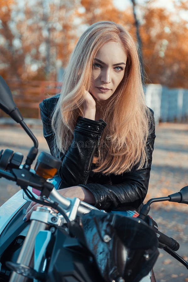 The girl on a motorcycle. stock photo. Image of active - 139484674