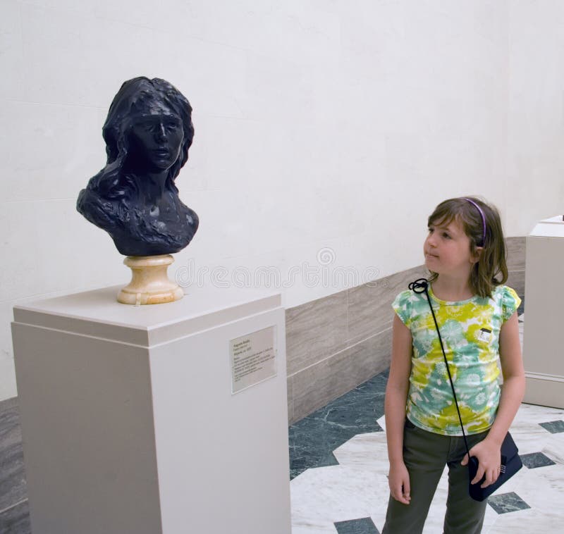 The Girl in the Museum Attentively Listens To the Guide. Stock Photo ...