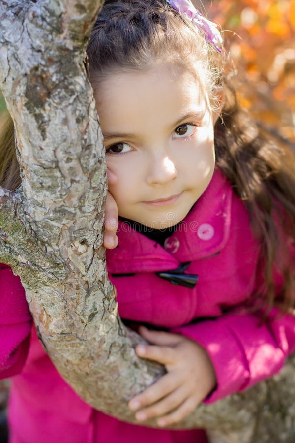 Girl Near a Tree in the Park Stock Photo - Image of purple, girl: 44826036