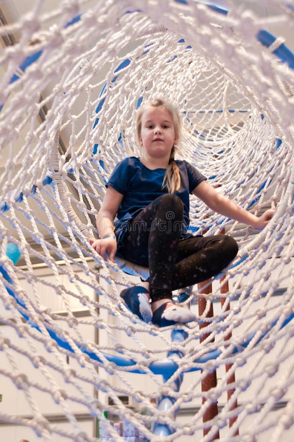 Girl in Net Sleeve of Amusement Park Climbing Facility Stock Image ... Girl in Net Sleeve of Amusement Park Climbing Facility Stock Image ...
