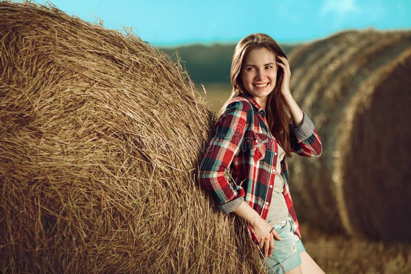 Girl next to haystack stock photo. Image of pretty, country - 48738714