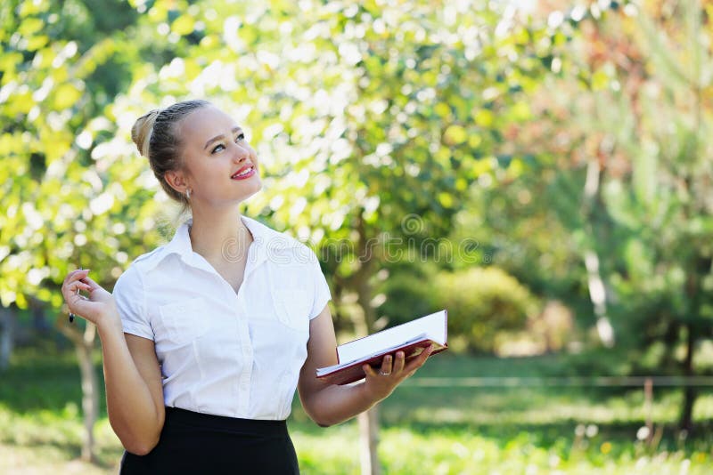 Girl with notebook stock image. Image of outdoors, park - 77820581
