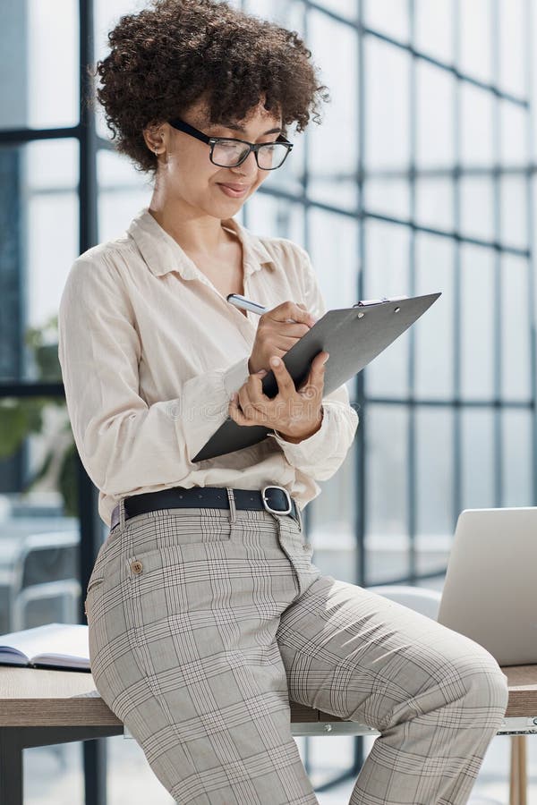 Girl in the Office Smiles Writing Notes Stock Photo - Image of person ...