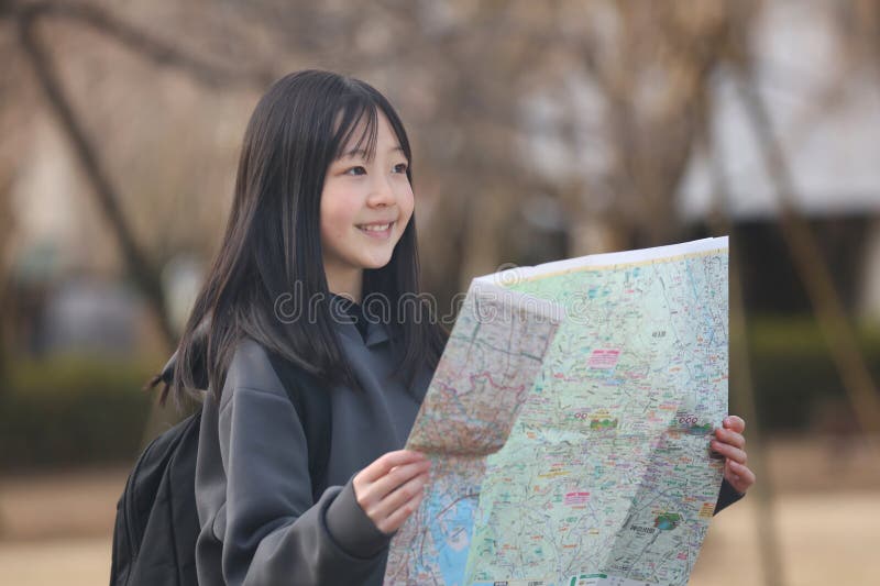 Girl opening a map stock photo. Image of autumn, cute - 343350854
