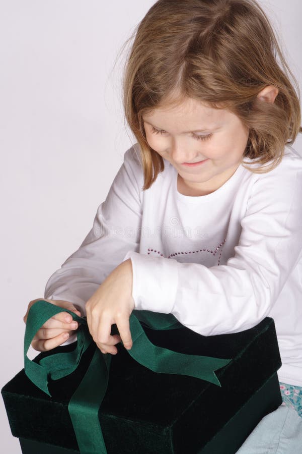 Girl Opening A Present Picture. Image: 1961864