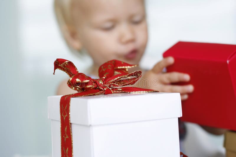 Girl opening presents stock image. Image of present, horizontal - 6499237