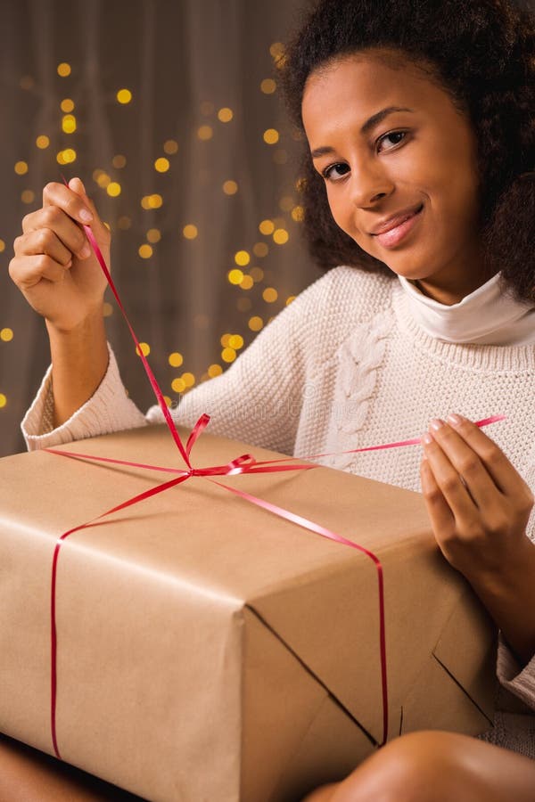 Girl opening xmas present stock photo. Image of american - 61474520