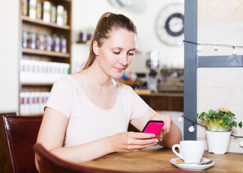 Girl Ordered Coffee and Chatting in the Phone Stock Image - Image of ...