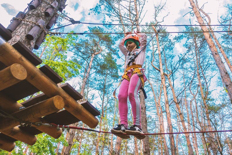 The Girl Overcomes Obstacles on the Road from the Stretched Ropes Stock ...