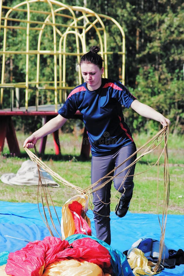 The Young Girl-parachutist Sits on a Blue Fabric Stock Image - Image of ...