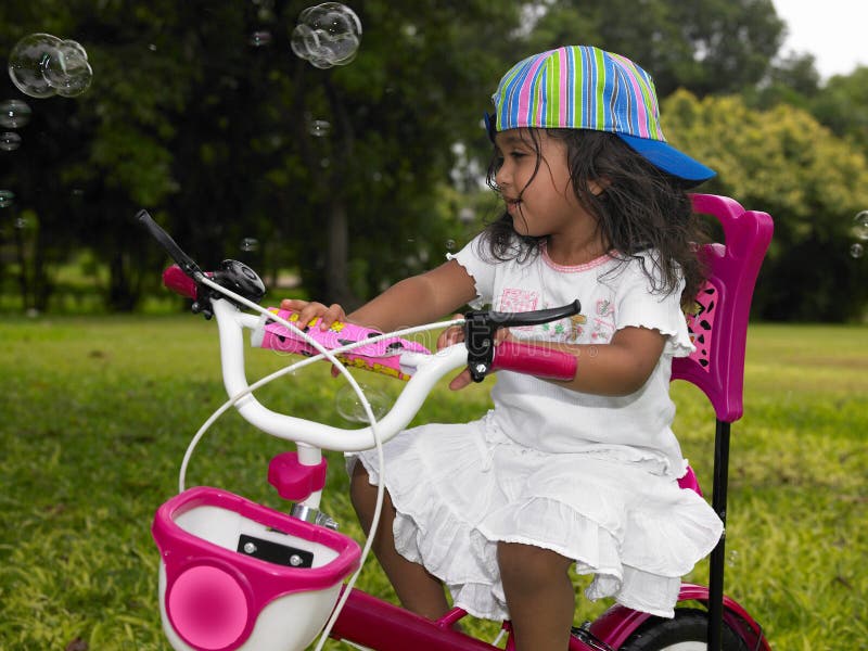 Girl the Park Riding Her Cycle Stock Image - Image of playful, shirt ...