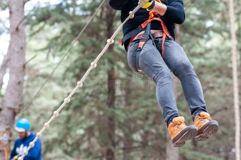 Girl Performing Adventure Path in the Adventure Park in the Forest ...