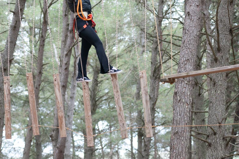 Girl Performing Adventure Path in the Adventure Park in the Forest ...