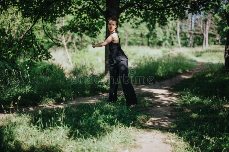 Girl Performing Modern Dance in Nature with Trees and Sunlight Stock ...