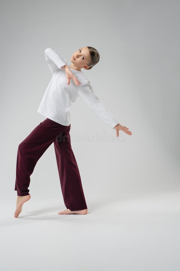 Girl Performs an Expressive Dance Routine in a Modern Art Studio ...