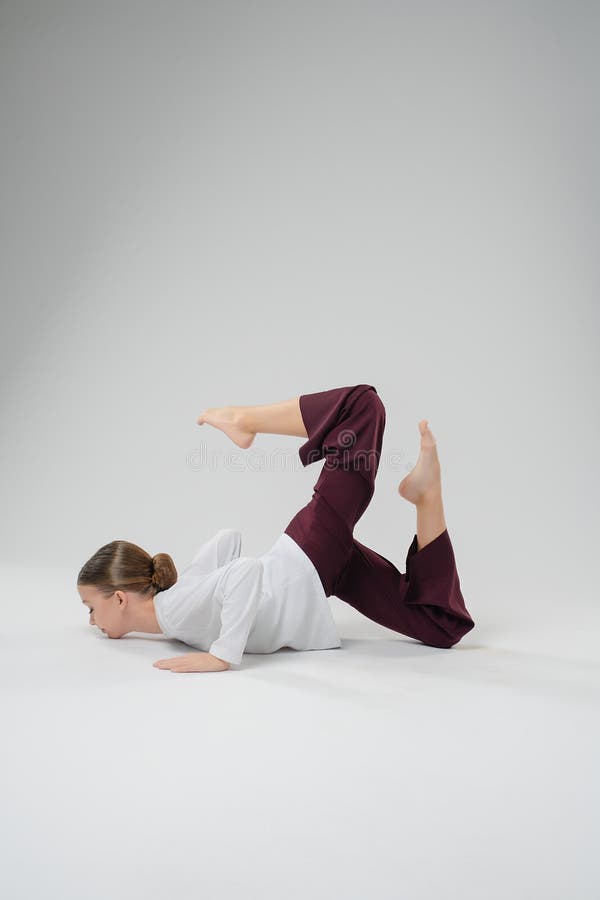 Girl Performs an Impressive Dance Pose Showcasing Athletic Skill and ...