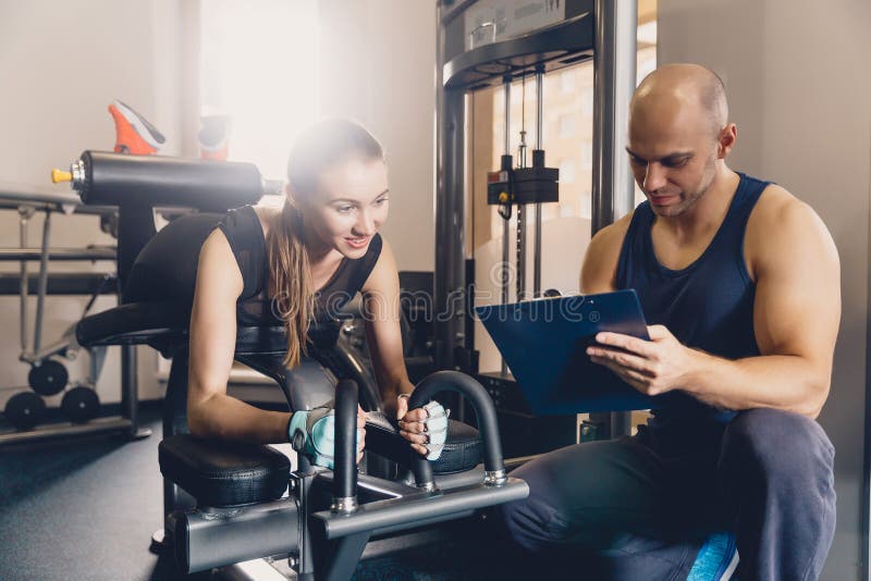 Girl Performs Training with an Individual Trainer. Stock Image - Image ...