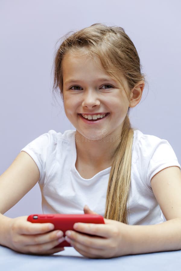Girl with phone stock image. Image of play, beautiful - 20533039