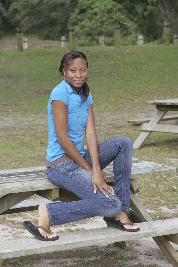 Girl on picnic table stock image. Image of stare, lean - 7369533