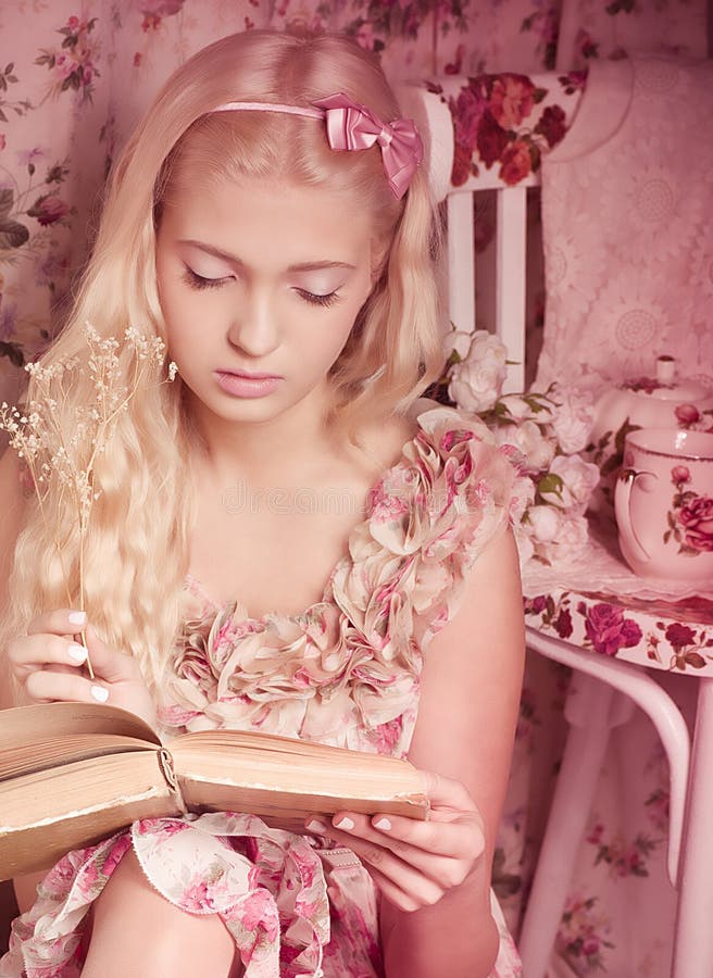 Girl in Pink Dress Reading Book Stock Photo - Image of doll, female ...