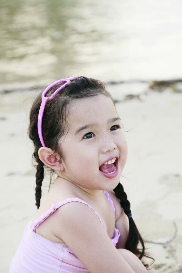 Girl in Pink Having Fun on the Beach. Conceptual Image Stock Image ...