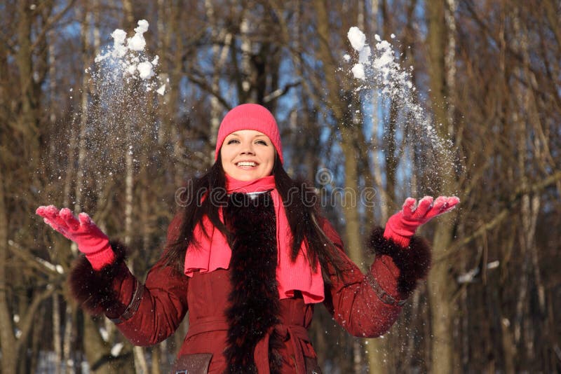 Girl in Pink Scarf and Hat Throwing Up Snow Stock Image - Image of ...