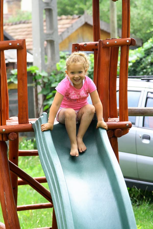 Girl on slide stock image. Image of slip, friends, happy - 8494155