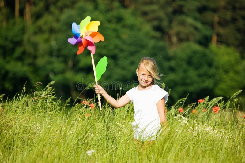 Girl with pinwheel stock photo. Image of daughter, playful - 5739610