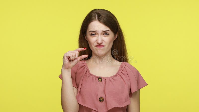 Girl Pitiful Expression and Showing a Little Bit Gesture. Stock Video ...