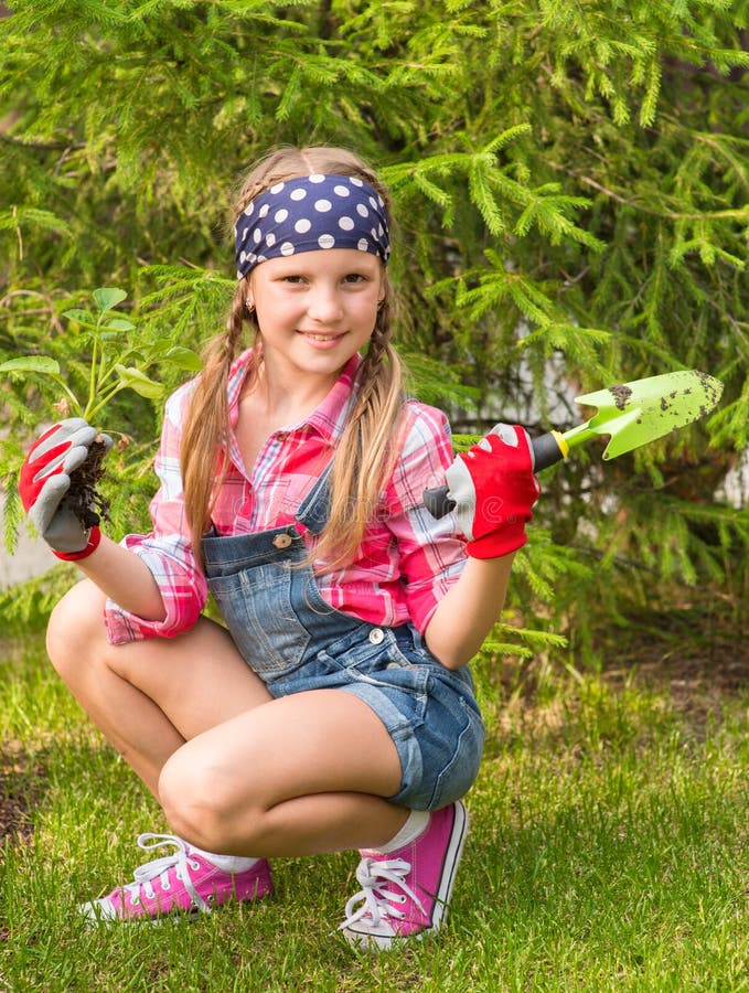 Planting Plants. a Woman Plants Young Sprouts in the Ground. Close-up ...