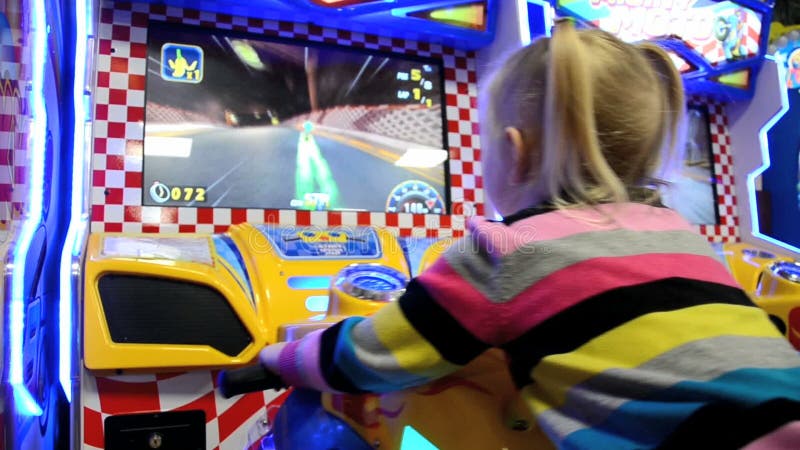 Girl Playing Arcade Game Machine at an Amusement Park Stock Video ...