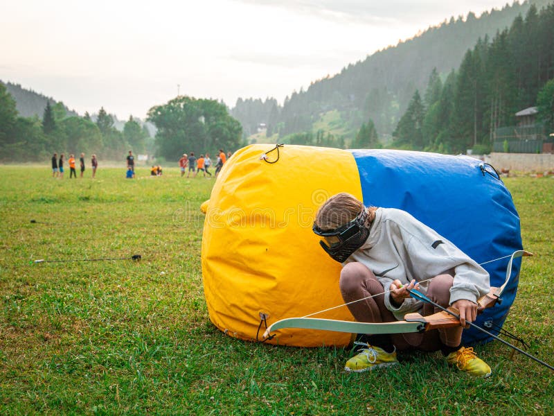 Girl Playing Archery Tag on a Field Editorial Stock Photo - Image of ...