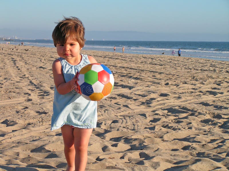 Girl playing at the beach stock photo. Image of throw - 1549548