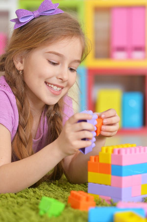 Girl playing with blocks stock image. Image of clever - 94842353