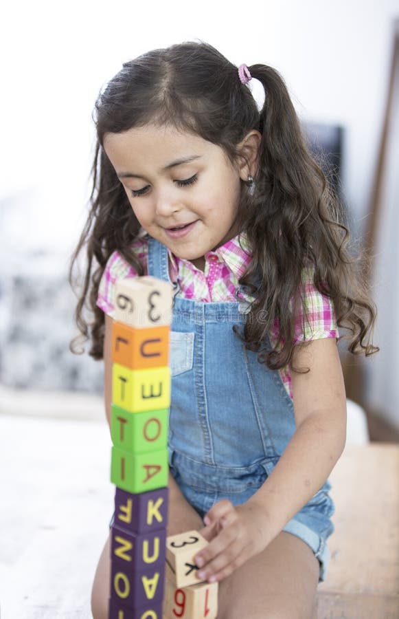 Girl Playing with Blocks at Home Stock Photo - Image of child, female ...